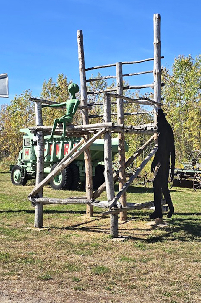 An extraterrestrial visitor takes a break on this rustic observation platform, perhaps contemplating the strange creatures who built it.