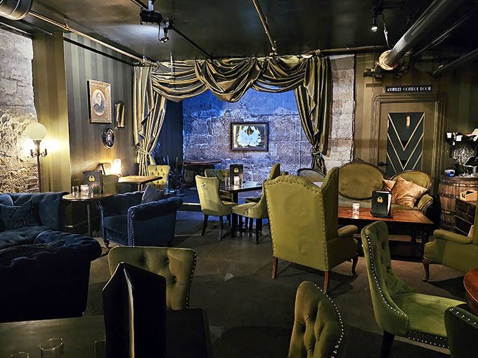 Another Interior Angle: Vintage furnishings create intimate parlor vibes where jade velvet chairs invite you to linger over one more perfectly crafted cocktail.