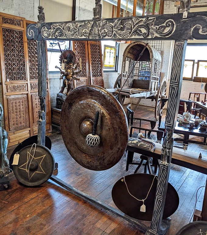 This ornate gong and carved frame showcase the Asian antiques section's more dramatic offerings.