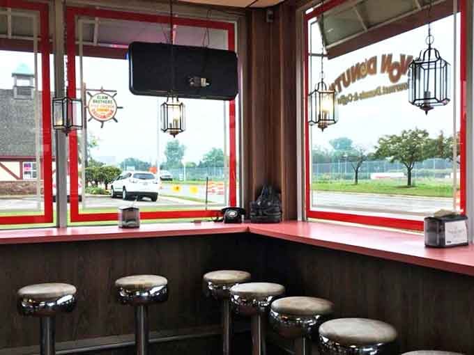 Window seating offers the perfect perch for people-watching while contemplating whether to order "just one more" donut.