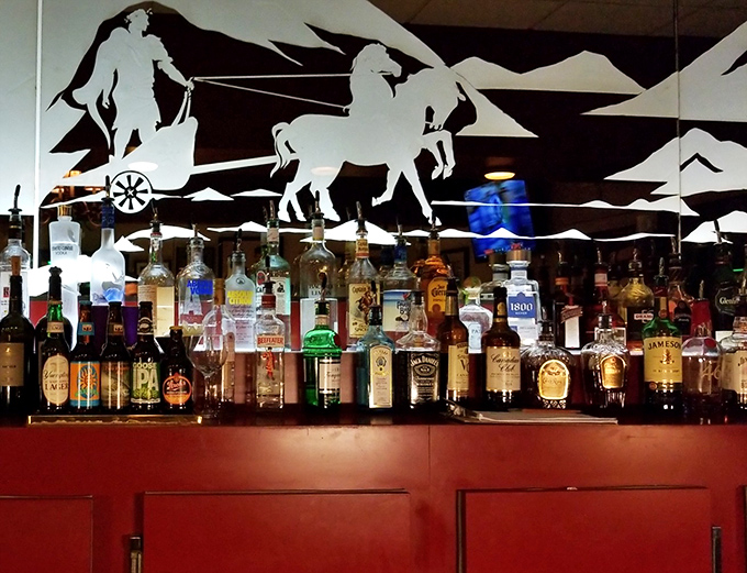 A closer look at the bar reveals an impressive array of spirits, with Roman chariots and soldiers creating a thematic backdrop.