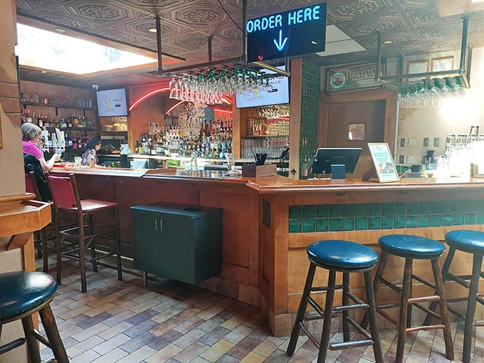 The bar's inviting setup practically whispers "sit down, stay awhile"&mdash;blue stools waiting for patrons seeking margaritas and memorable conversations.