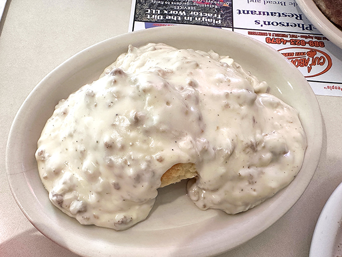 Biscuits smothered in creamy sausage gravy – a dish so comforting it should come with a pillow for the inevitable food nap.