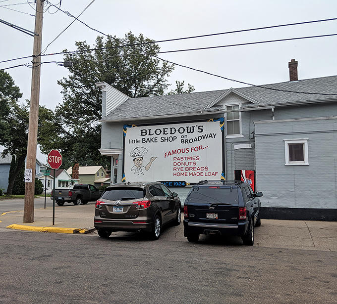 Plenty of space to park while you shop! See the big gray building on Broadway, famous for donuts since 1924.