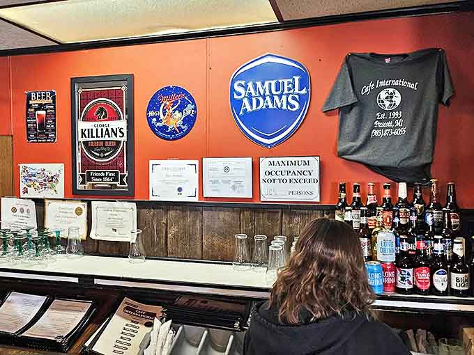 The corrugated metal bar front adds rustic charm to this international outpost, where Samuel Adams shares space with flags from around the world.