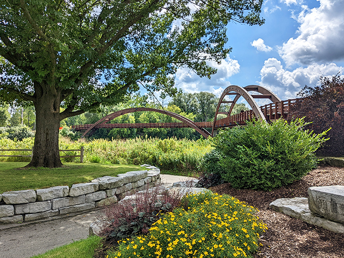 The view from Chippewassee Park showcases how seamlessly The Tridge connects natural spaces with human ingenuity.