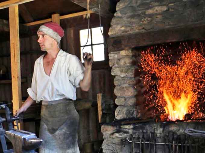 Feel the heat of history as the blacksmith demonstrates his crucial craft, creating the tools that built America one hammer strike at a time.