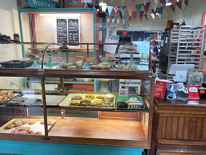 The counter area showcases fresh baked goods like edible artwork, making every decision feel important because honestly, how do you choose between this much deliciousness?