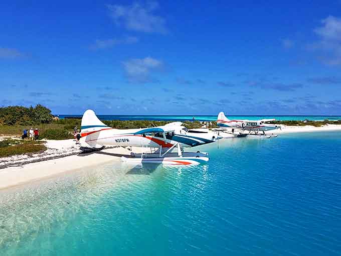 Seaplanes rest on beaches that belong in travel fantasies, offering lucky passengers the ultimate entrance to Florida's most spectacular hidden gem.
