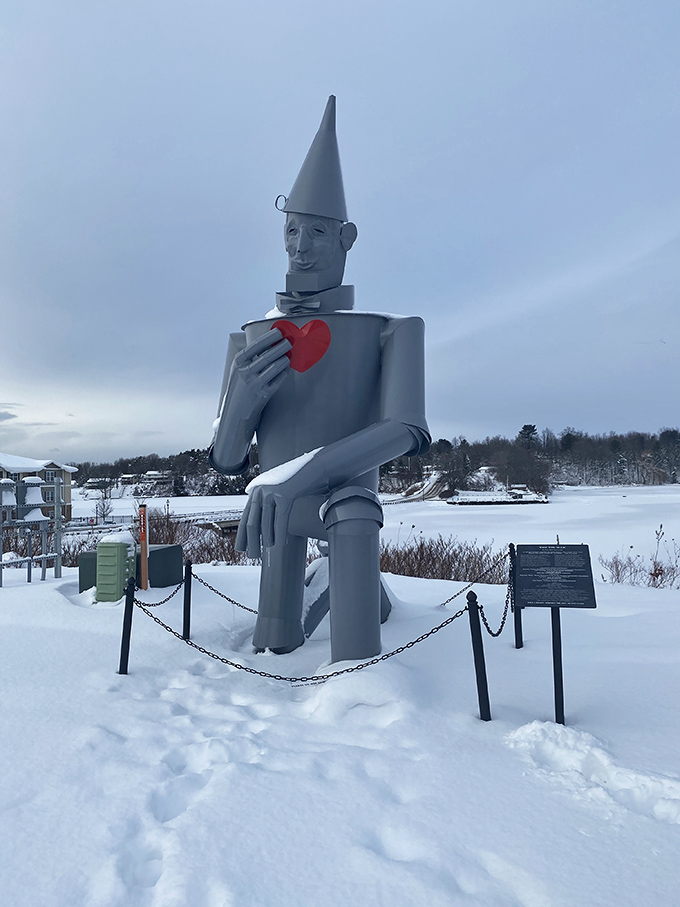 Winter transforms the Tin Man into a snow-dusted sentinel, standing watch over a frozen landscape of white-blanketed charm.