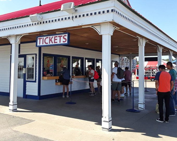 The long dock stretches toward adventure, building anticipation as visitors make their way to board the waiting pirate ship.