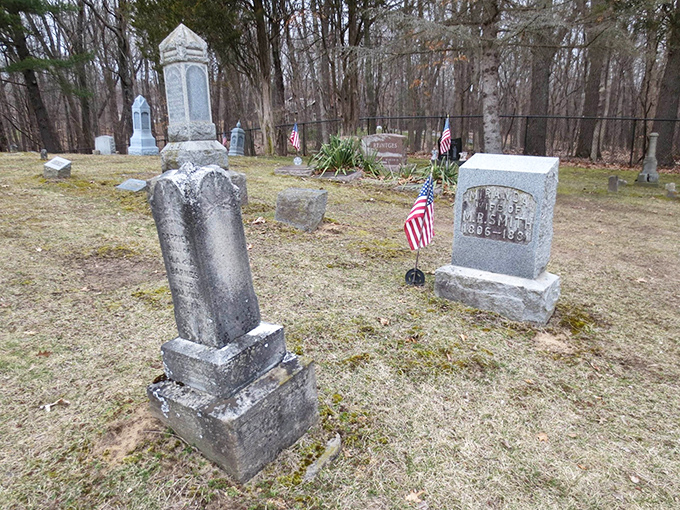 American flags mark the graves of those who served their country, adding patriotic touches to this allegedly haunted ground.