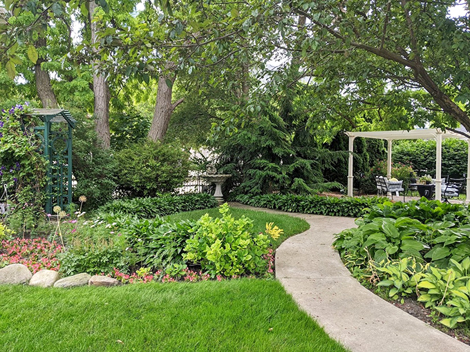 Garden Pathway & Pergola: Lush greenery frames winding paths that invite morning strolls or evening wanderings through this meticulously maintained outdoor sanctuary.