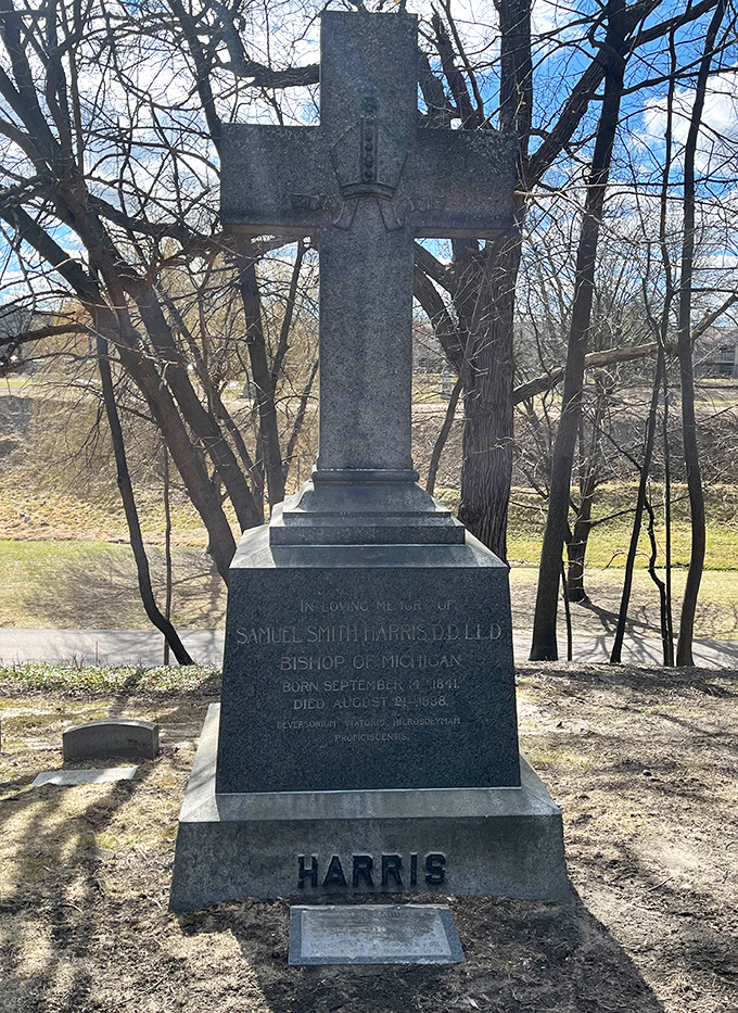 Bishop Harris's imposing cross stands as testament to Michigan's religious heritage, its weathered surface telling tales of spiritual leadership.