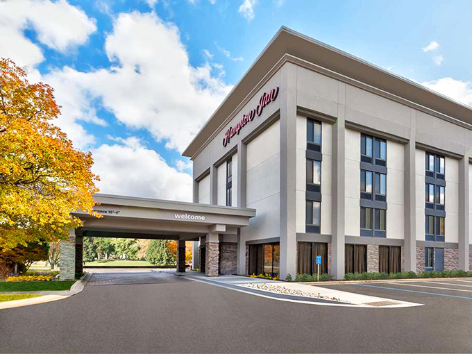 The Hampton Inn's clean lines and welcoming entrance promise a good night's sleep between days filled with Traverse City adventures.