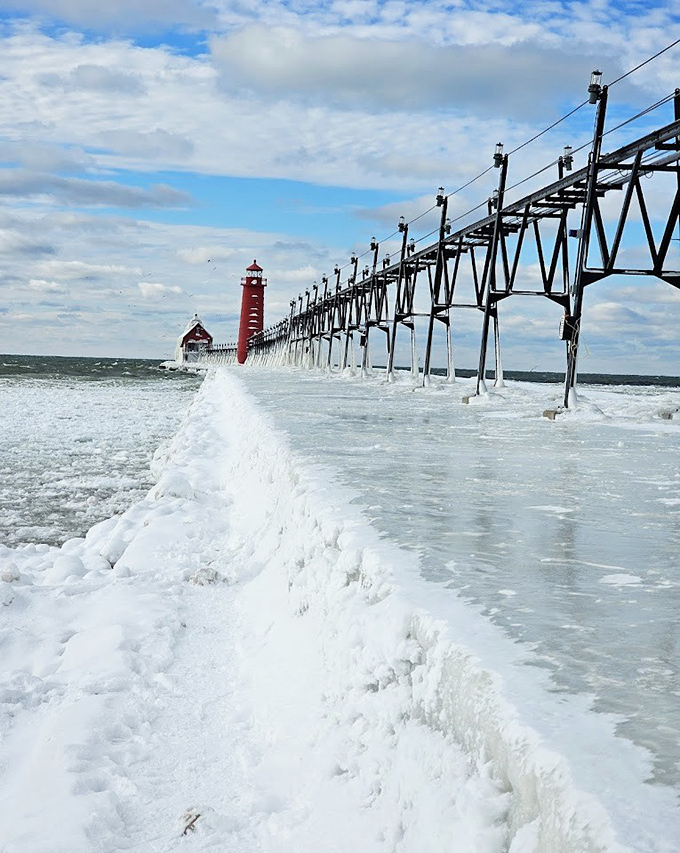 Ice-encrusted during winter storms, the lighthouse and pier transform into a crystalline wonderland that draws photographers from miles around.