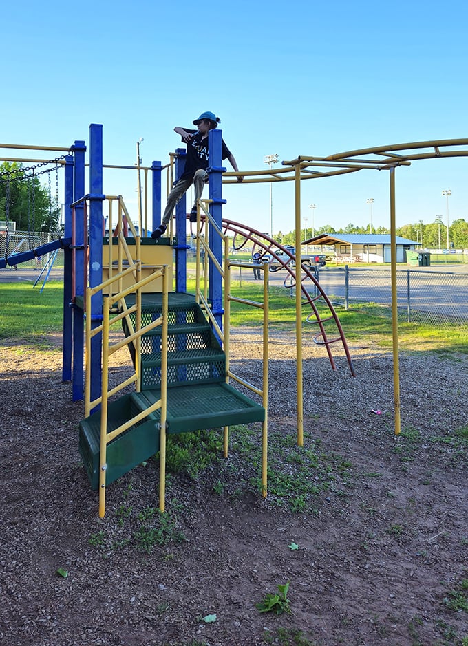 Kids climb toward the clouds at one of Ishpeming's community gathering spots, where laughter echoes across generations.