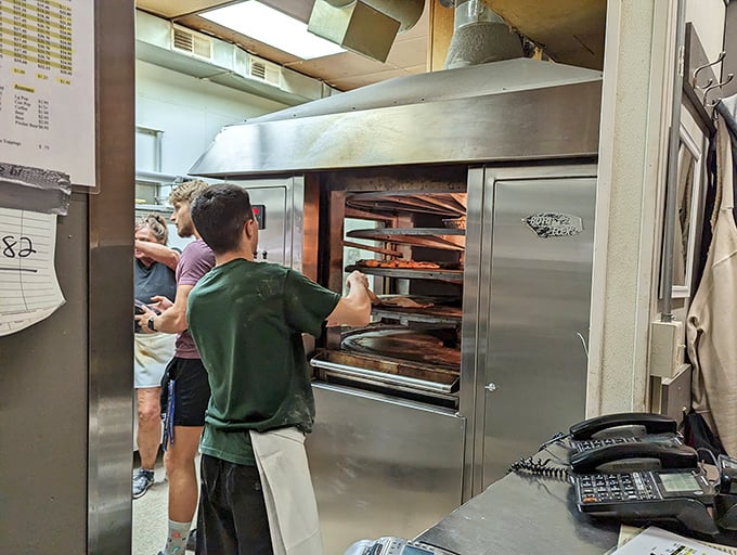 A glimpse into the kitchen reveals the pizza-making magic &ndash; where dough becomes dreams in the hands of experienced staff.