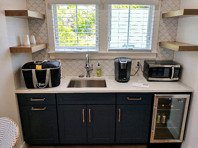 Kitchenette Counter: Scalloped backsplash tiles elevate this compact refreshment station where vacation snacks somehow contain zero calories.