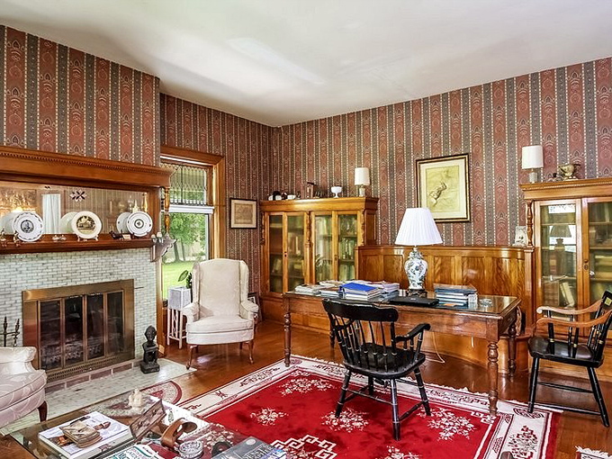 Wood-paneled sanctuary with striped wallpaper where you'll finally read that classic novel (or more likely, a beach thriller).