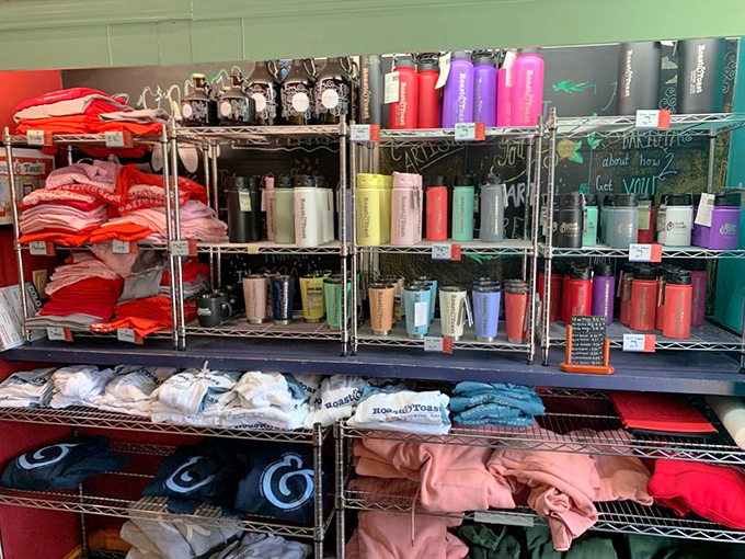Merch: A colorful collection of mugs, shirts, and coffee beans that let you take a piece of the Roast & Toast experience home.