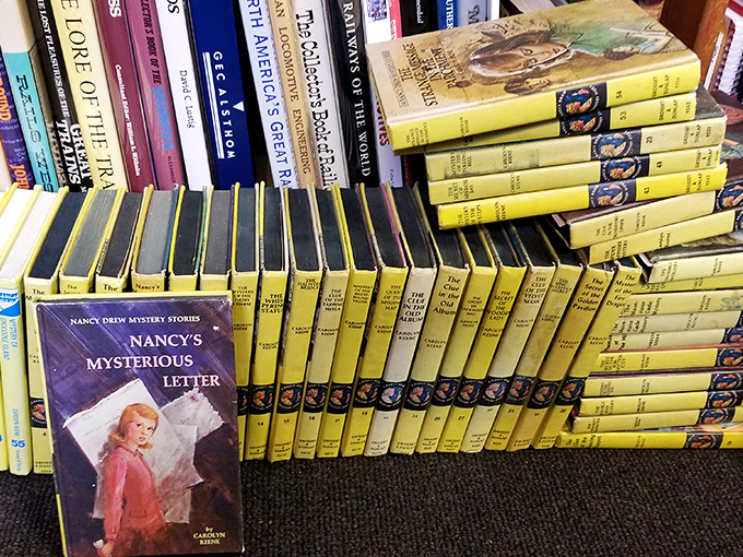 Nancy Drew's distinctive yellow spines stand like sunny soldiers, ready to introduce new generations to the thrill of solving mysteries one page at a time.