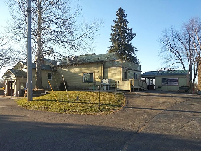 From another angle, the historic building reveals its farmhouse roots while proudly displaying the American flag &ndash; tradition served alongside innovation.