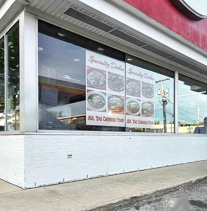 The exterior view showcases the restaurant's distinctive red and white color scheme. Standing out like a culinary beacon for those in the know.
