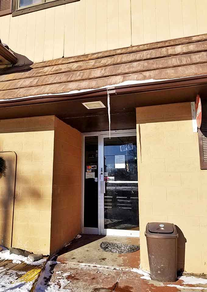 The welcoming entrance promises good things await inside – sometimes the most unassuming doors lead to the most satisfying meals.