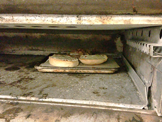 The sacred space where pasties transform from raw dough to golden perfection in the well-seasoned oven.
