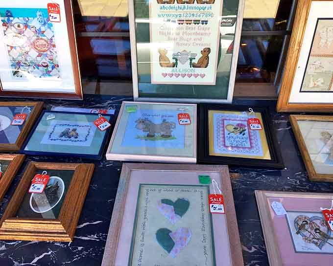 Framed needlepoint showcasing teddy bears and hearts – because grandmothers have always known that cuteness is timeless.