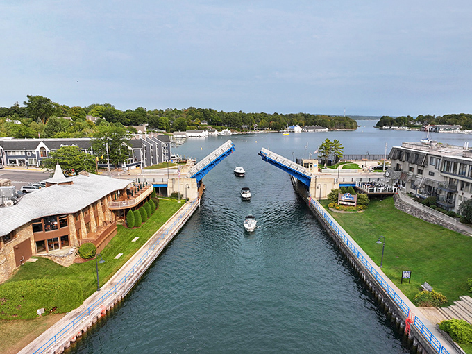 The Pine River Channel's drawbridge performs its mechanical ballet, allowing boats to parade between Lake Charlevoix and Lake Michigan.