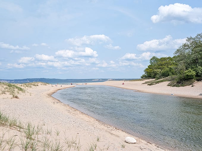 Where the Platte River meets Lake Michigan, creating a perfect swimming spot with options for both warm and refreshingly cool waters.