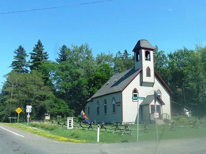 This quaint country church has witnessed generations of local history, standing sentinel along the scenic byway.
