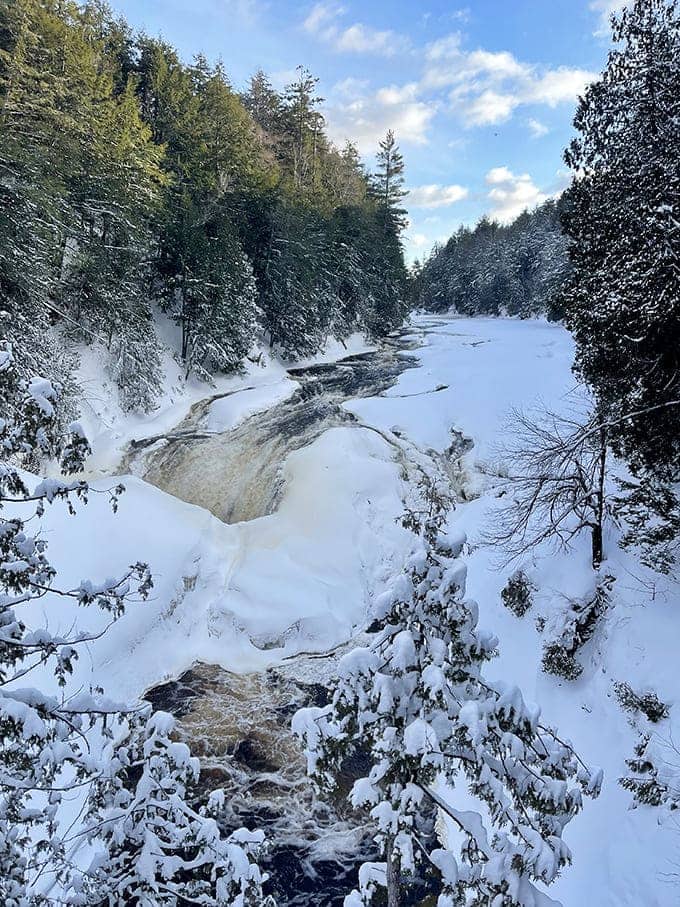 Winter transforms the falls into nature's ice sculpture garden – a hushed, pristine landscape where water and cold create frozen magic.