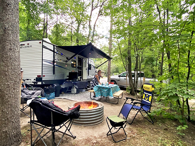 Modern camping comforts meet wilderness experience, with evening campfires creating the backdrop for tomorrow's adventure planning.