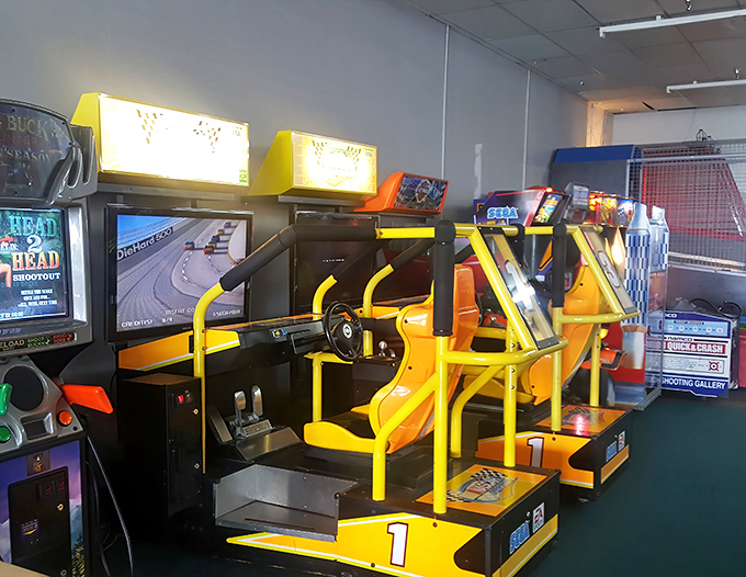 Racing simulators offer a taste of the action for those waiting their turn on the main track.
