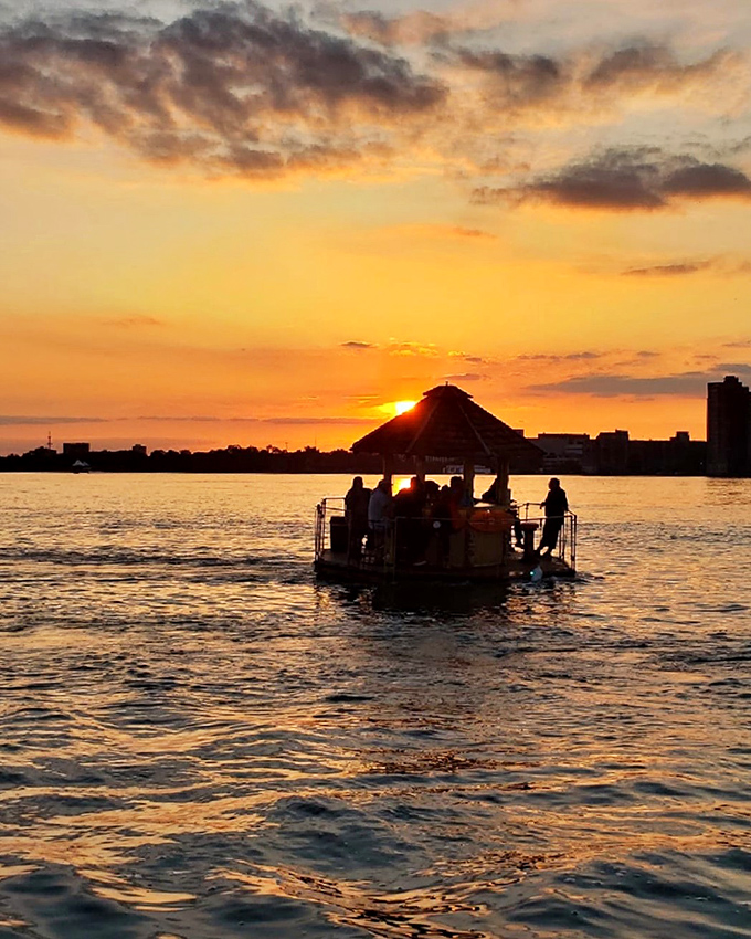 That sailboat gliding past the tiki boat represents the old guard meeting the new, tradition encountering innovation, sophistication bumping into pure unapologetic joy.