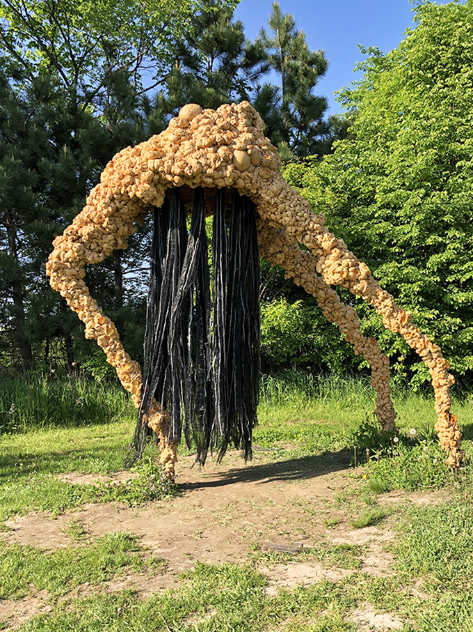 This textured arch creates a portal to view the world differently, framing other artworks and landscapes in unexpected ways.