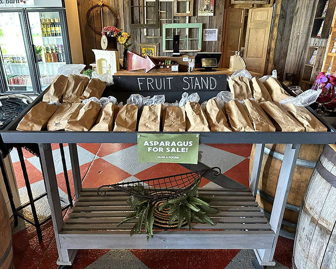 The rustic fruit stand offers seasonal Michigan produce in paper bags, bringing farmers' market freshness to your wine tasting adventure.