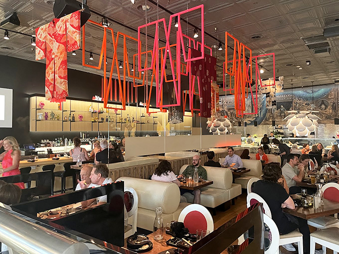 The main dining room balances sophistication with playfulness &ndash; those hanging red elements add drama without trying too hard.