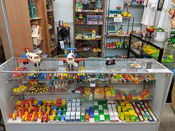 Childhood memories arranged by color &ndash; Fisher-Price planes, vintage vehicles, and enough Little People to populate a tiny town.