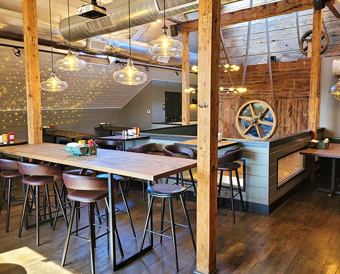 The upstairs dining area feels like discovering a secret clubhouse, complete with twinkling lights and cozy wooden accents.