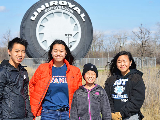 Visitors gather to marvel at Michigan's mammoth monument to mobility, creating memories that will roll with them forever.