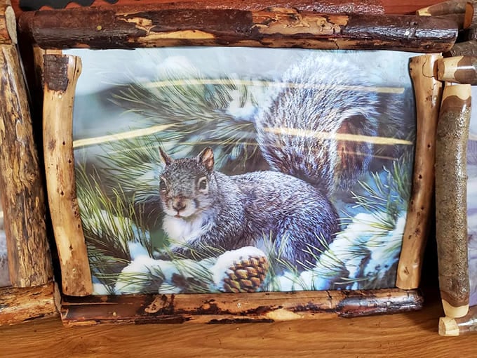 Nature meets craftsmanship in this framed wildlife print &ndash; rustic log framing transforms a simple squirrel image into a statement piece for cabin decor.