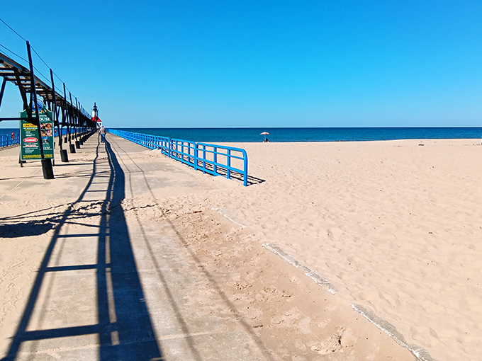 Bright blue railings guide visitors safely along the pier, adding a pop of color that perfectly complements Lake Michigan's ever-changing blues.