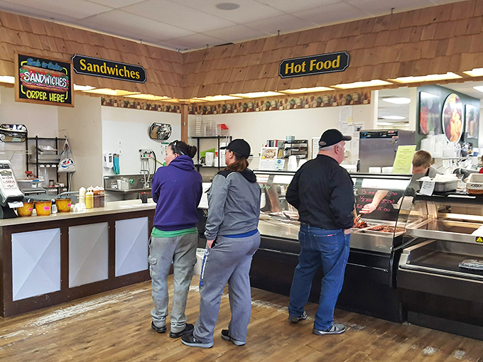 At the hot food counter, decisions become increasingly difficult as customers contemplate which homestyle dish will grace their dinner table tonight.