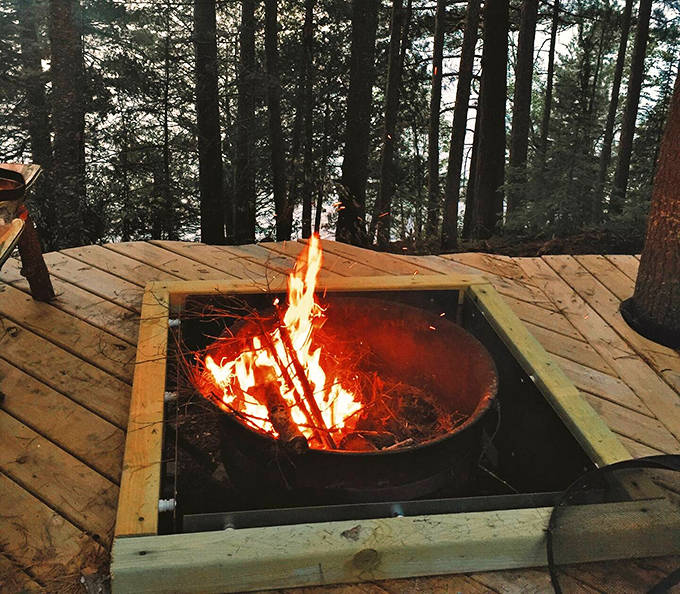 Fire pit seating where conversations deepen as the sun sets and wine loosens tongues in the best possible way.