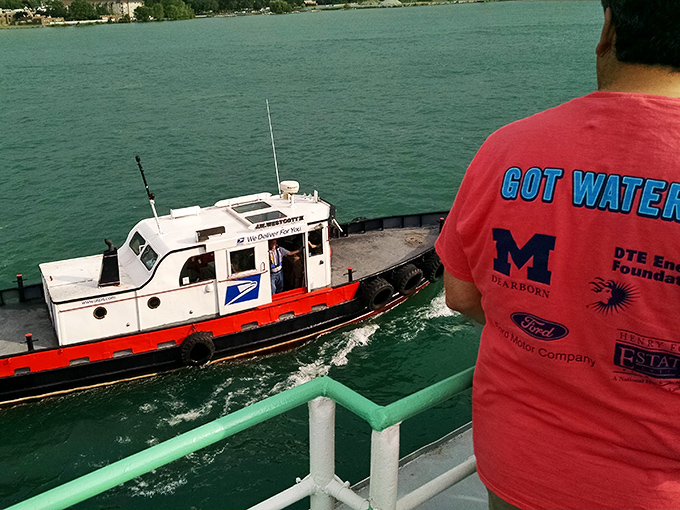 Special delivery! The Westcott performs its signature move, sidling up to a massive freighter for a mid-journey mail exchange.