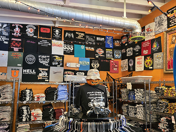 A wall of t-shirts proves that Hell has quite the sense of humor about itself. The pun possibilities are, well, endless.